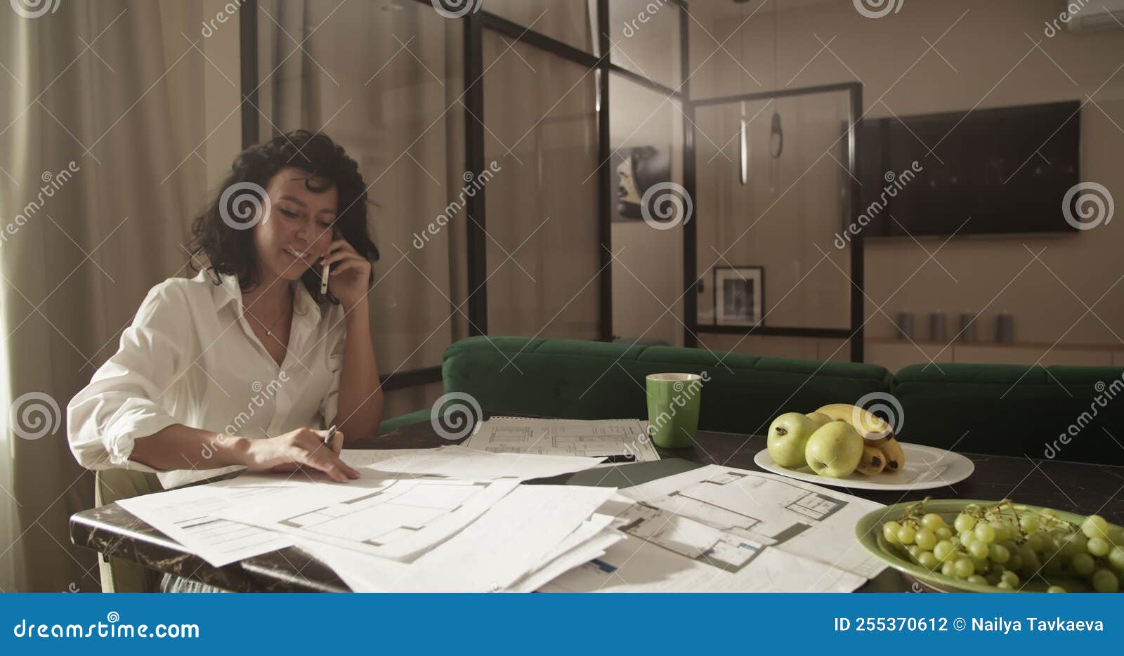 Woman Discussing Architectural Drafts during Phone Call Stock Footage ...