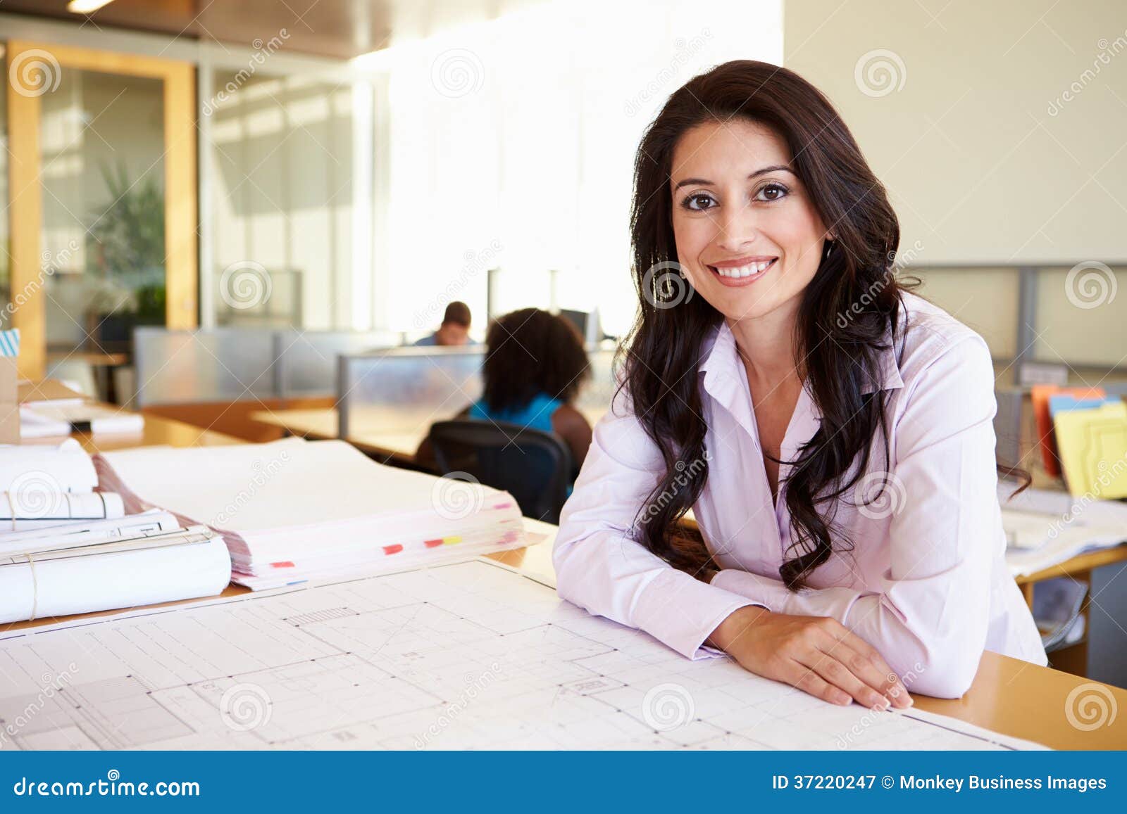 Female Architect Office Behind Desk Blueprints Stock Photography ...