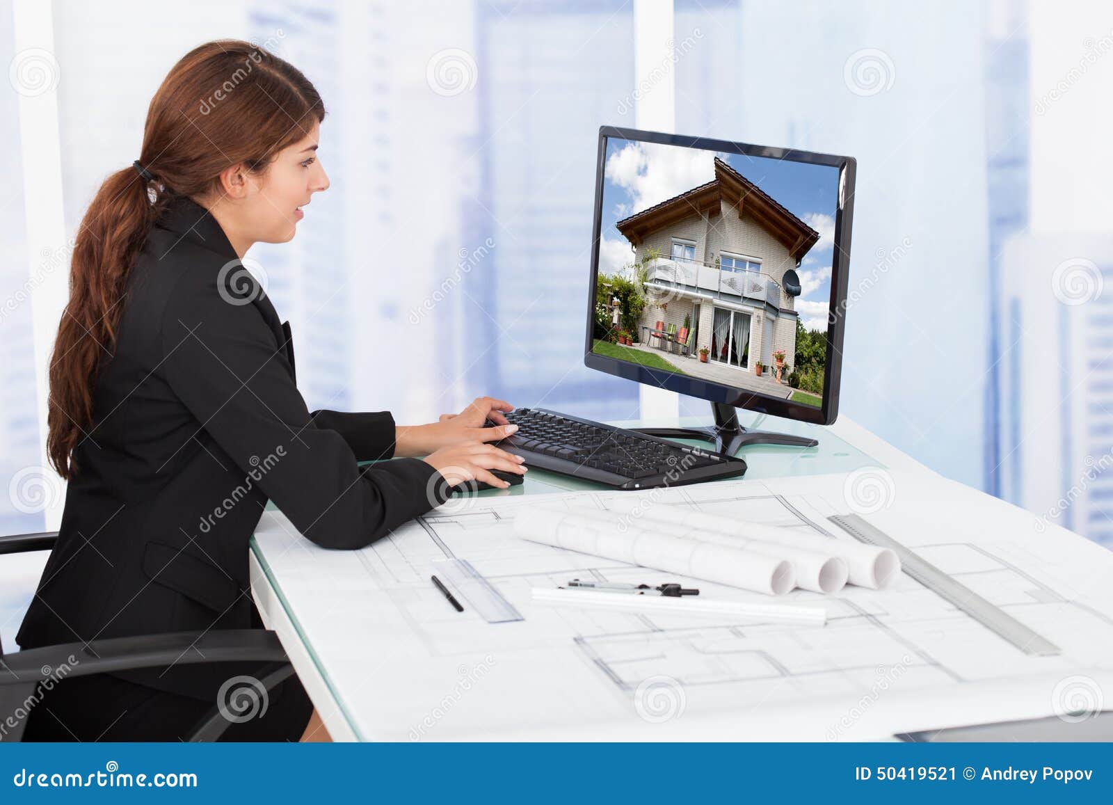 Female Architect Working On Blueprint At Desk Royalty-Free Stock Image ...