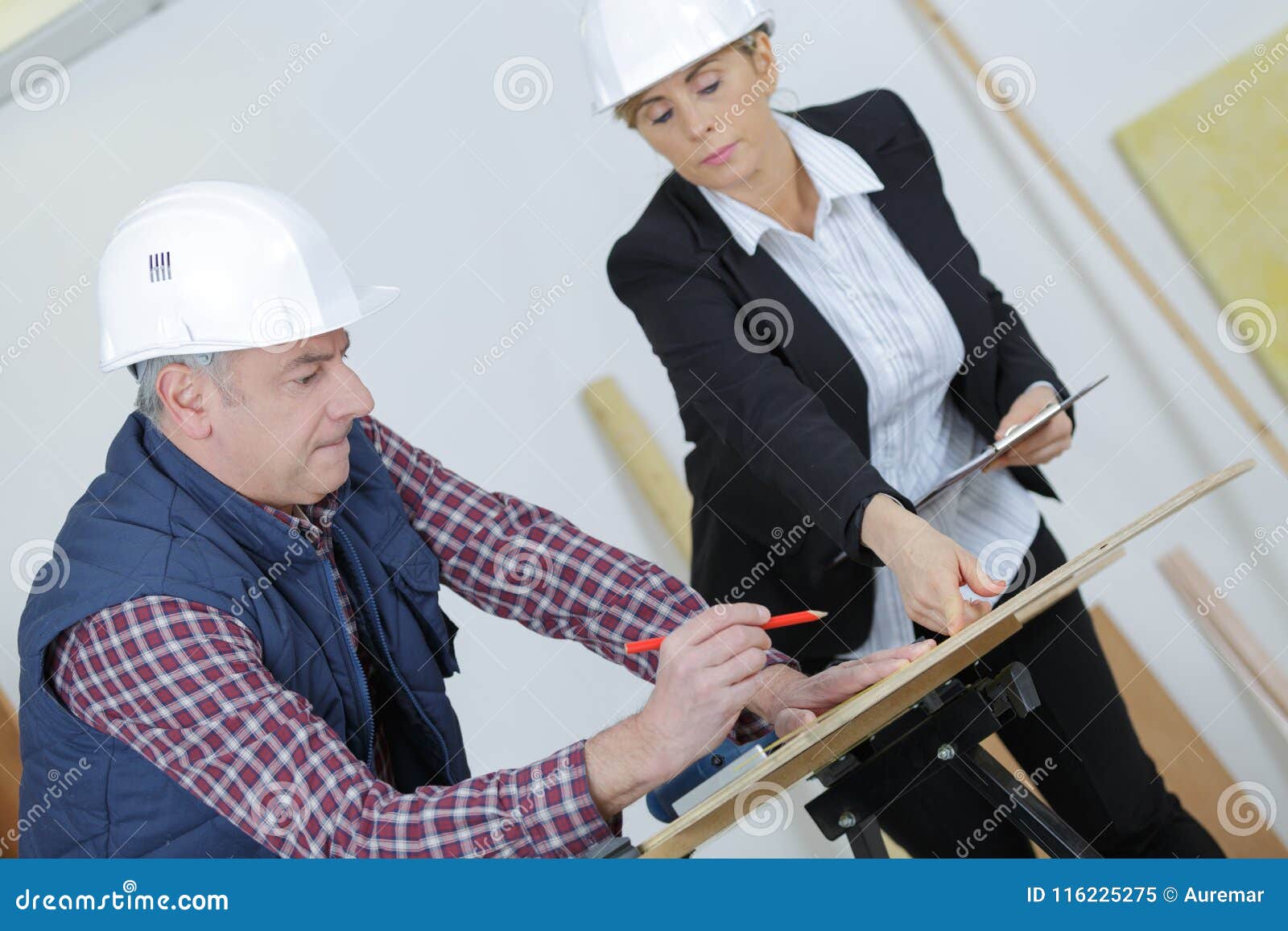 Female Architect Working with Construction Worker at Site Stock Image ...