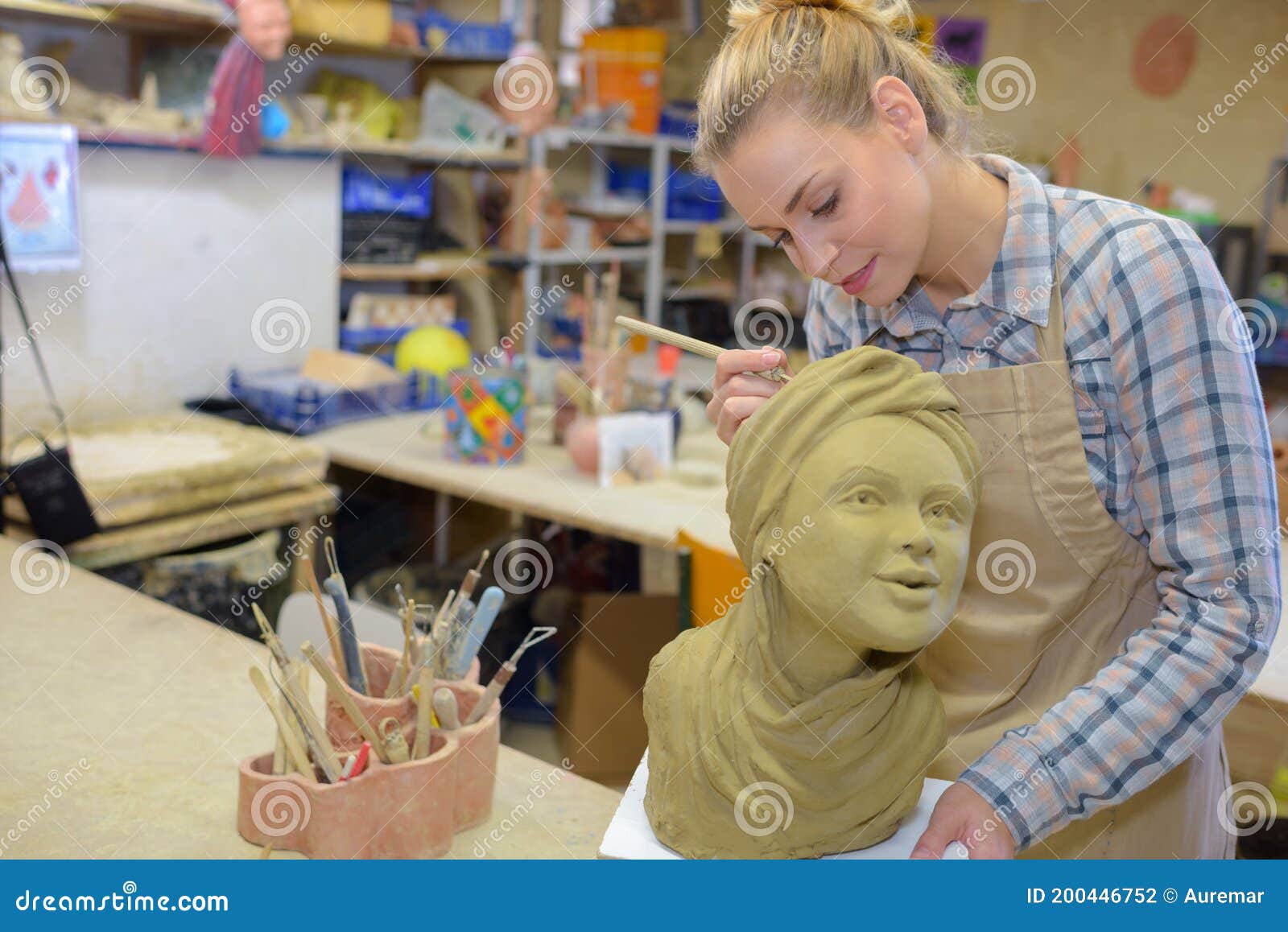 Female artist sculpting stock photo. Image of technique - 200446752