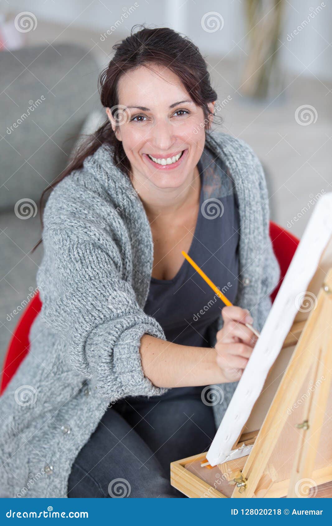 Female Artist Working on Painting in Bright Daylight Studio Stock Photo ...
