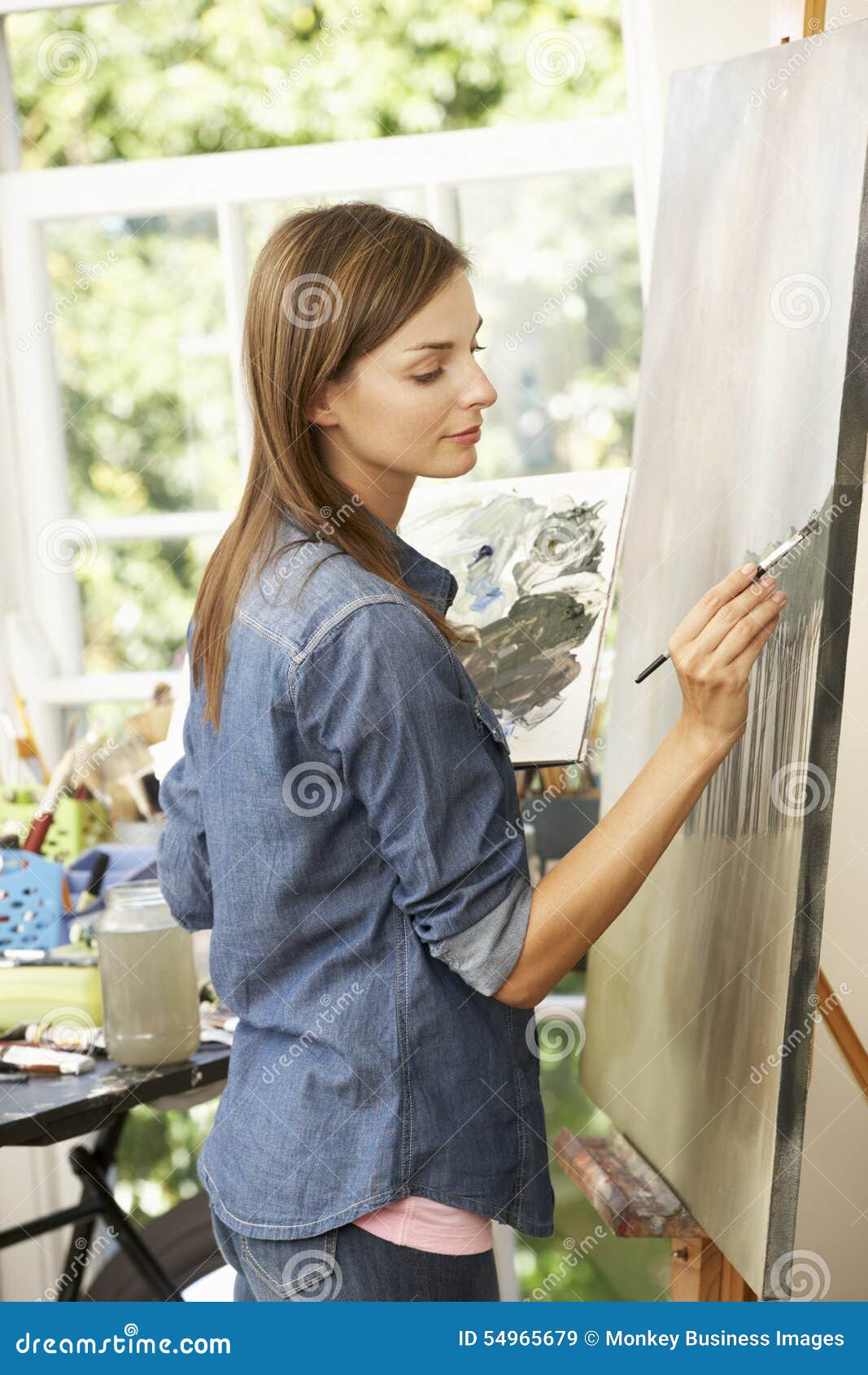 Female Artist Working on Painting in Studio Stock Image - Image of ...