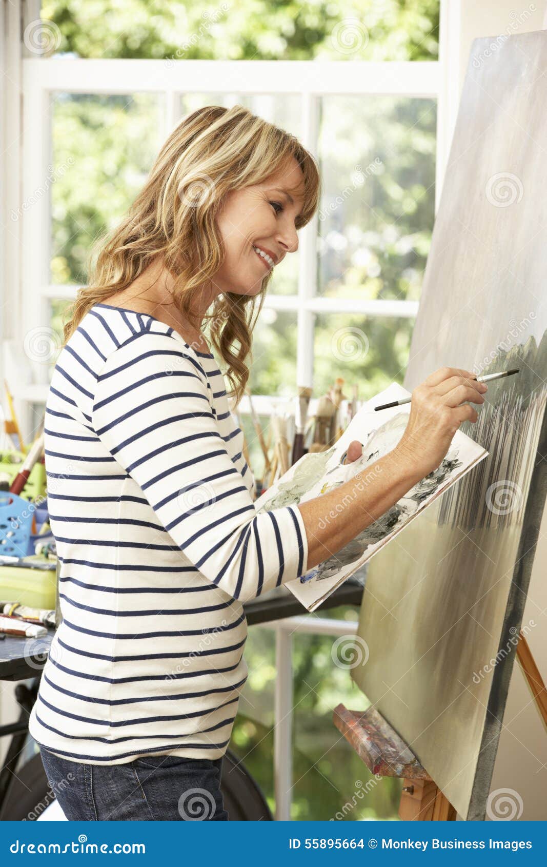 Female Artist Working on Painting in Studio Stock Photo - Image of ...