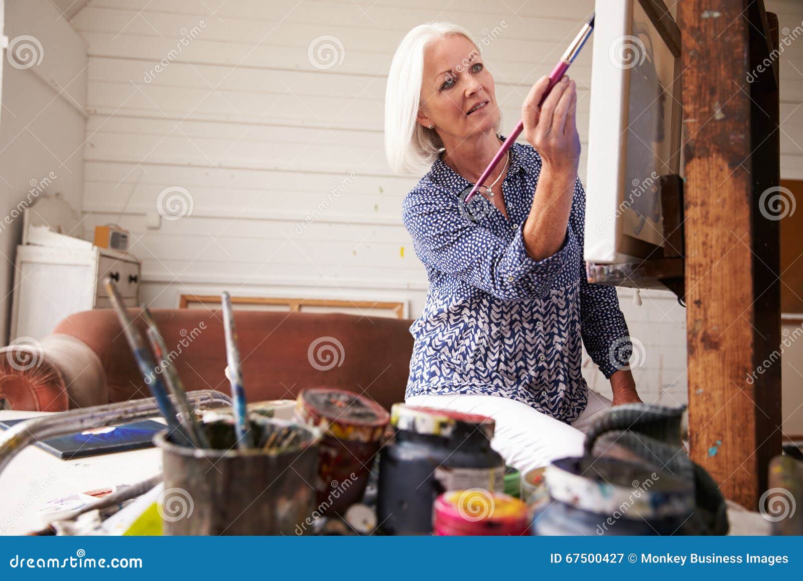 Female Artist Working on Painting in Studio Stock Image - Image of ...