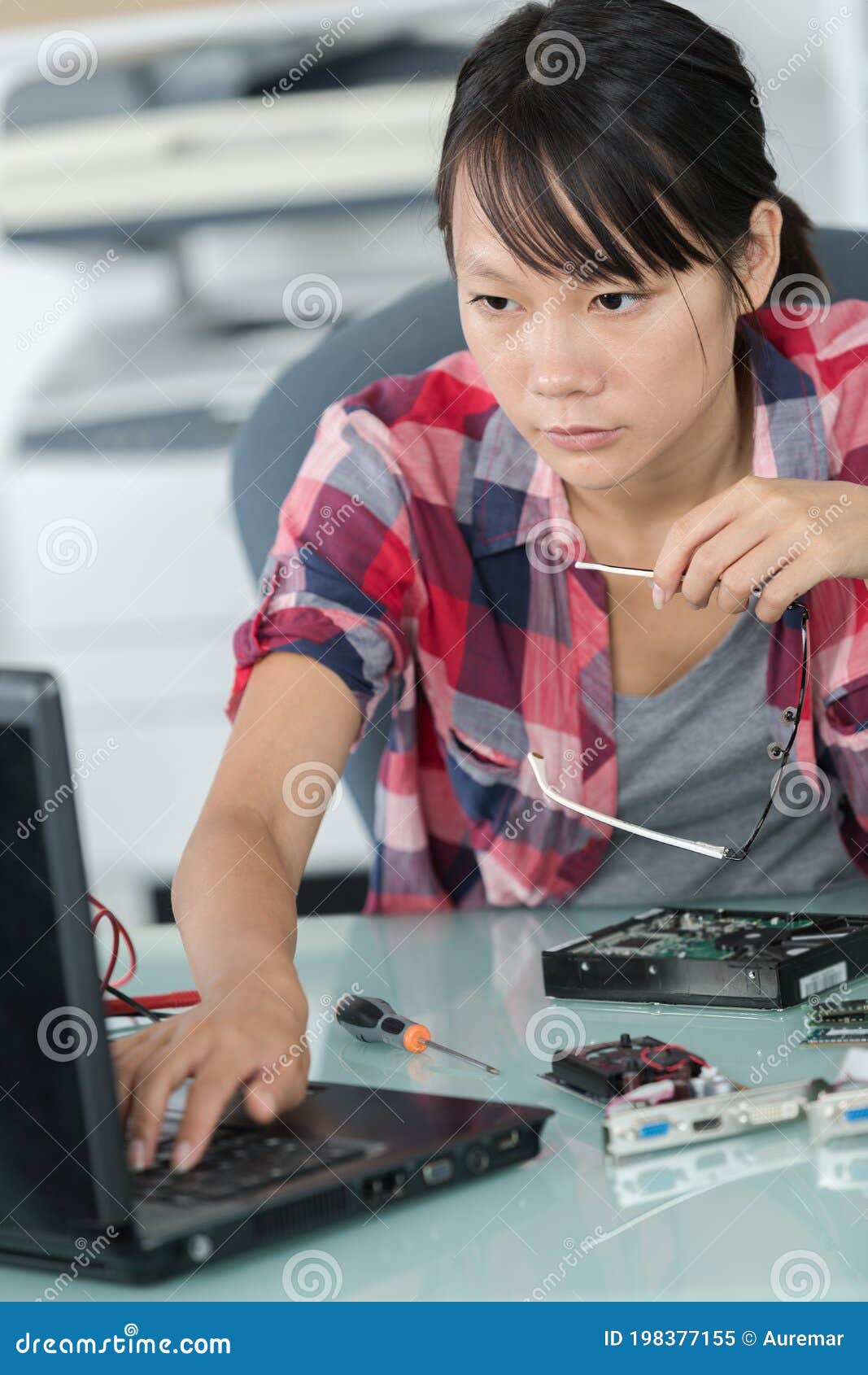 Female Asian Computer Technician Using Laptop Stock Image - Image of ...