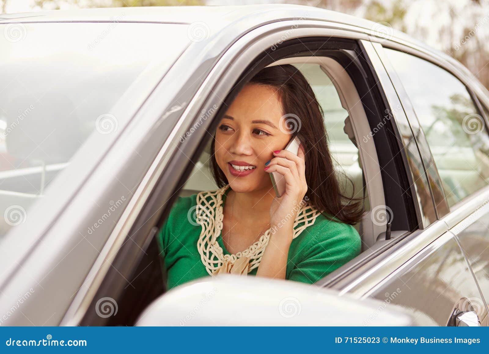 Female Asian Driver Using Phone in a Car Stock Image - Image of holding ...