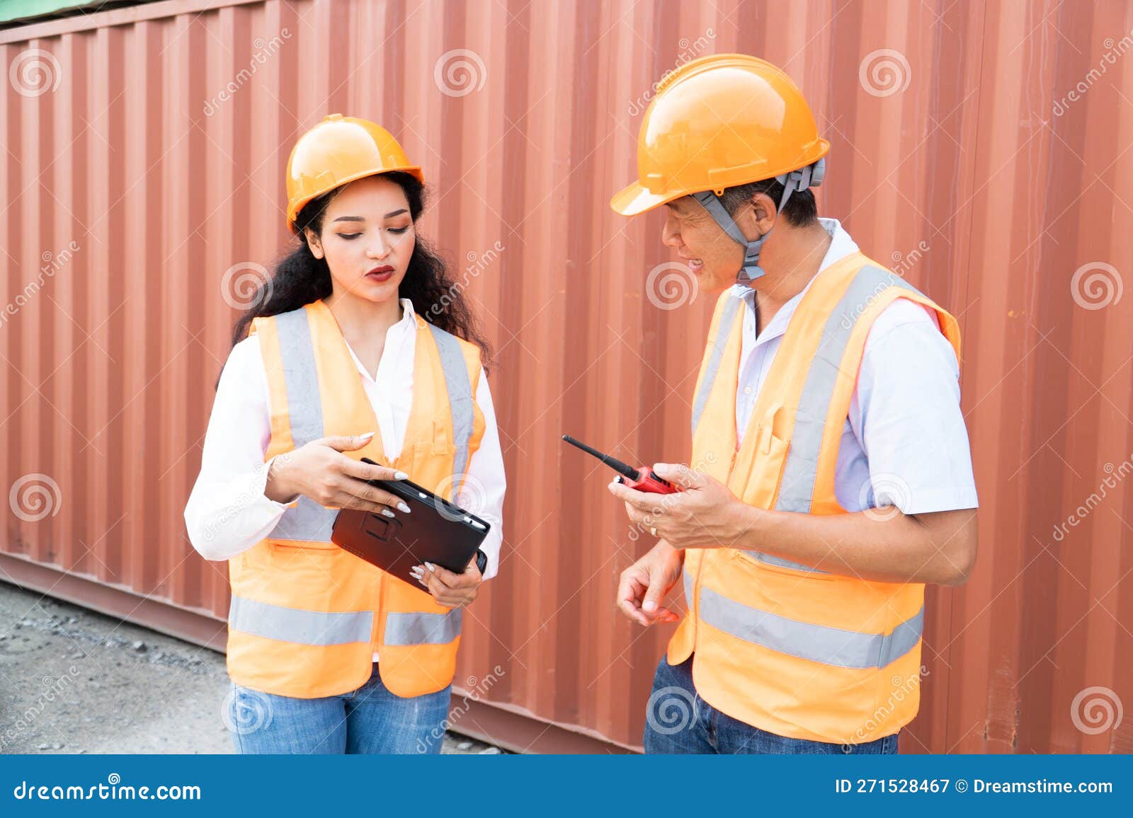 Female Asian Engineer and Foreman Engineer Loading Containers from ...
