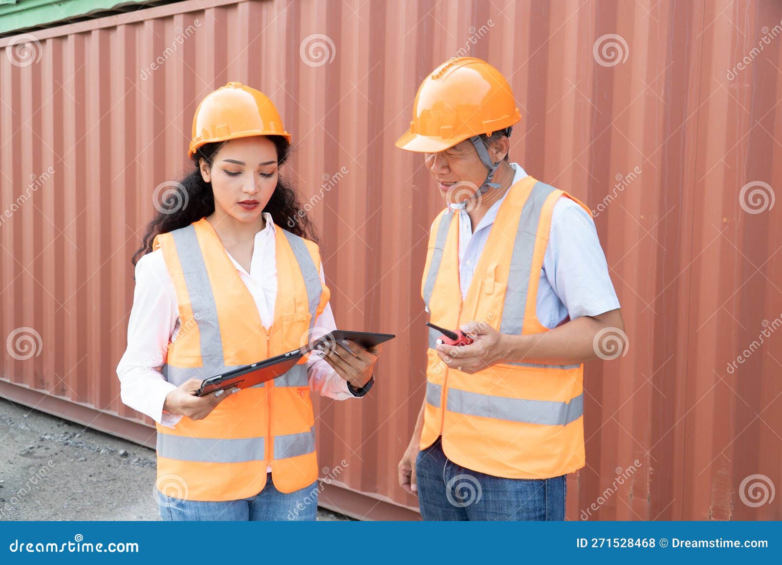 Female Asian Engineer and Foreman Engineer Loading Containers from ...