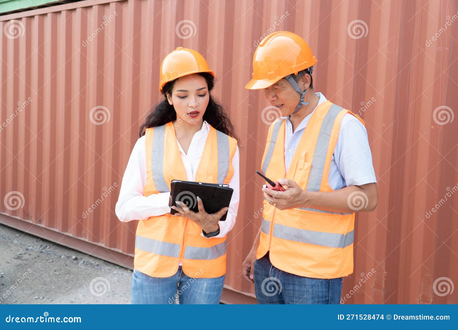 Female Asian Engineer and Foreman Engineer Loading Containers from ...