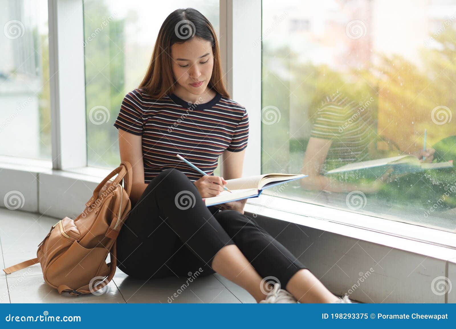 Female Asian Student Studying and Reading Book in Library Stock Image ...