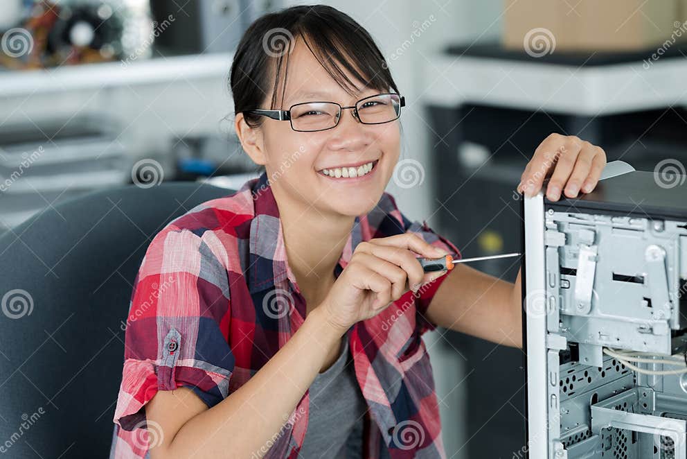 Female Asian Technician Working on Computer Stock Image - Image of ...