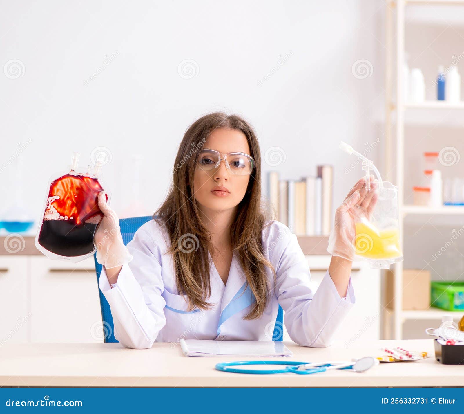 Female Assistant with Bag of Blood in the Lab Stock Image - Image of ...