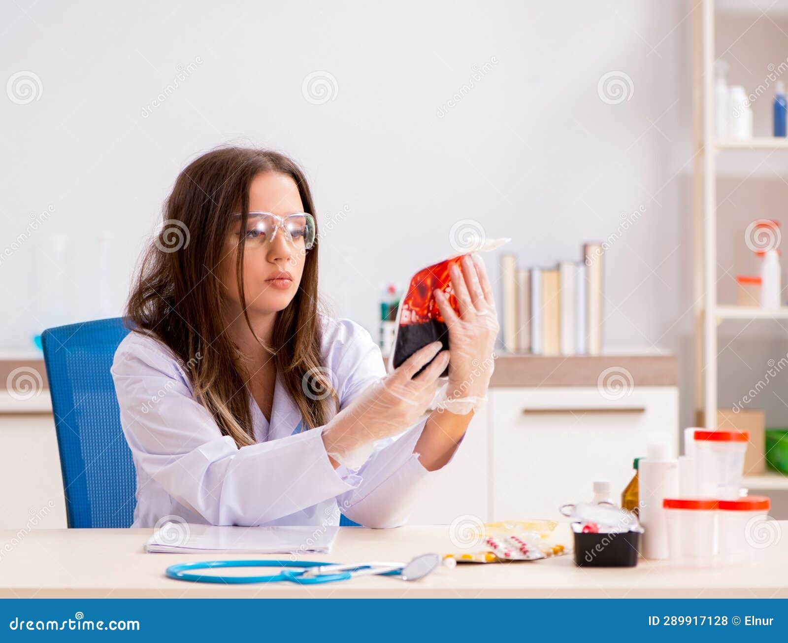 Female Assistant with Bag of Blood in the Lab Stock Photo - Image of ...