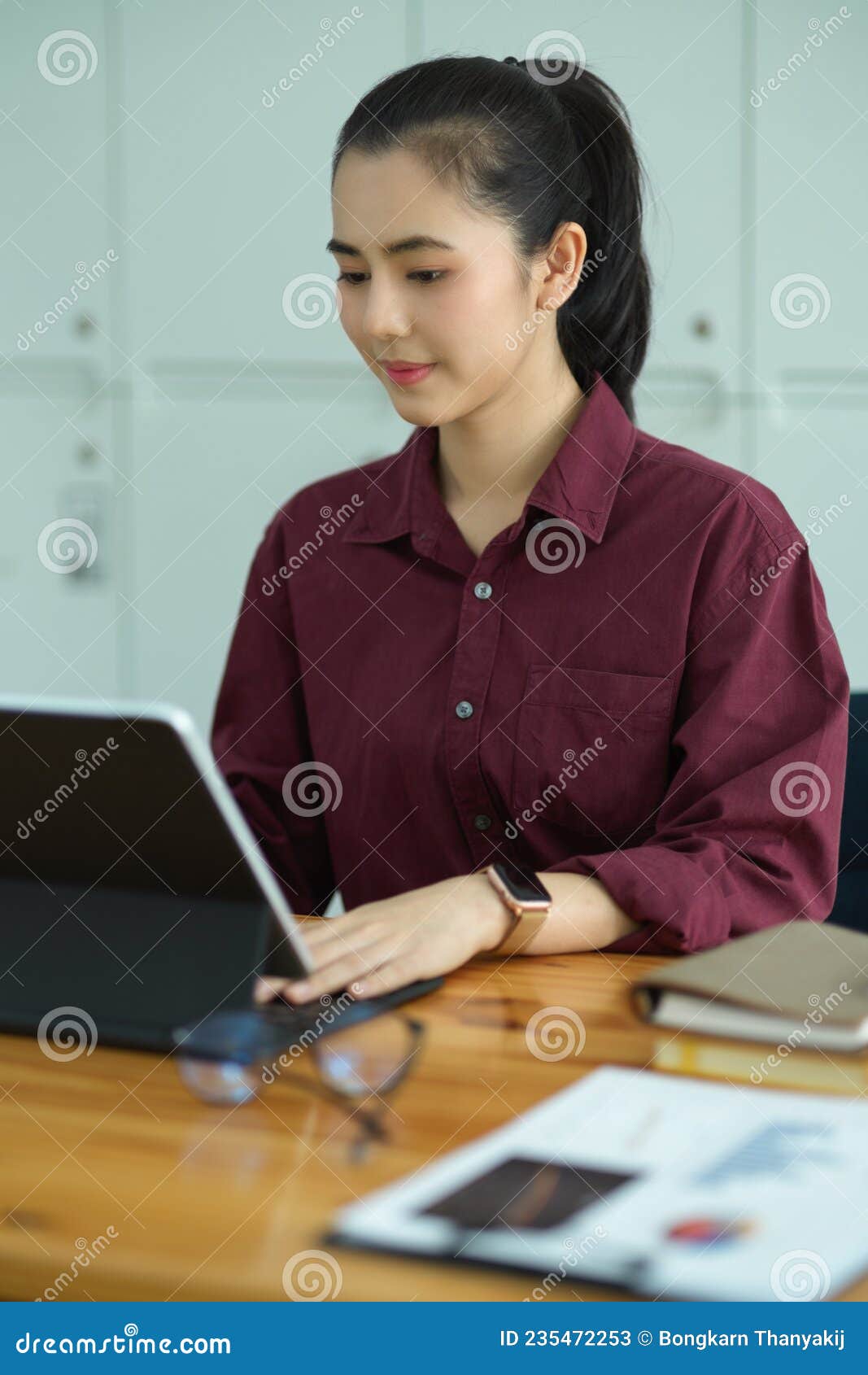 Female Assistant Working on Her Portable Tablet Computer Stock Image ...