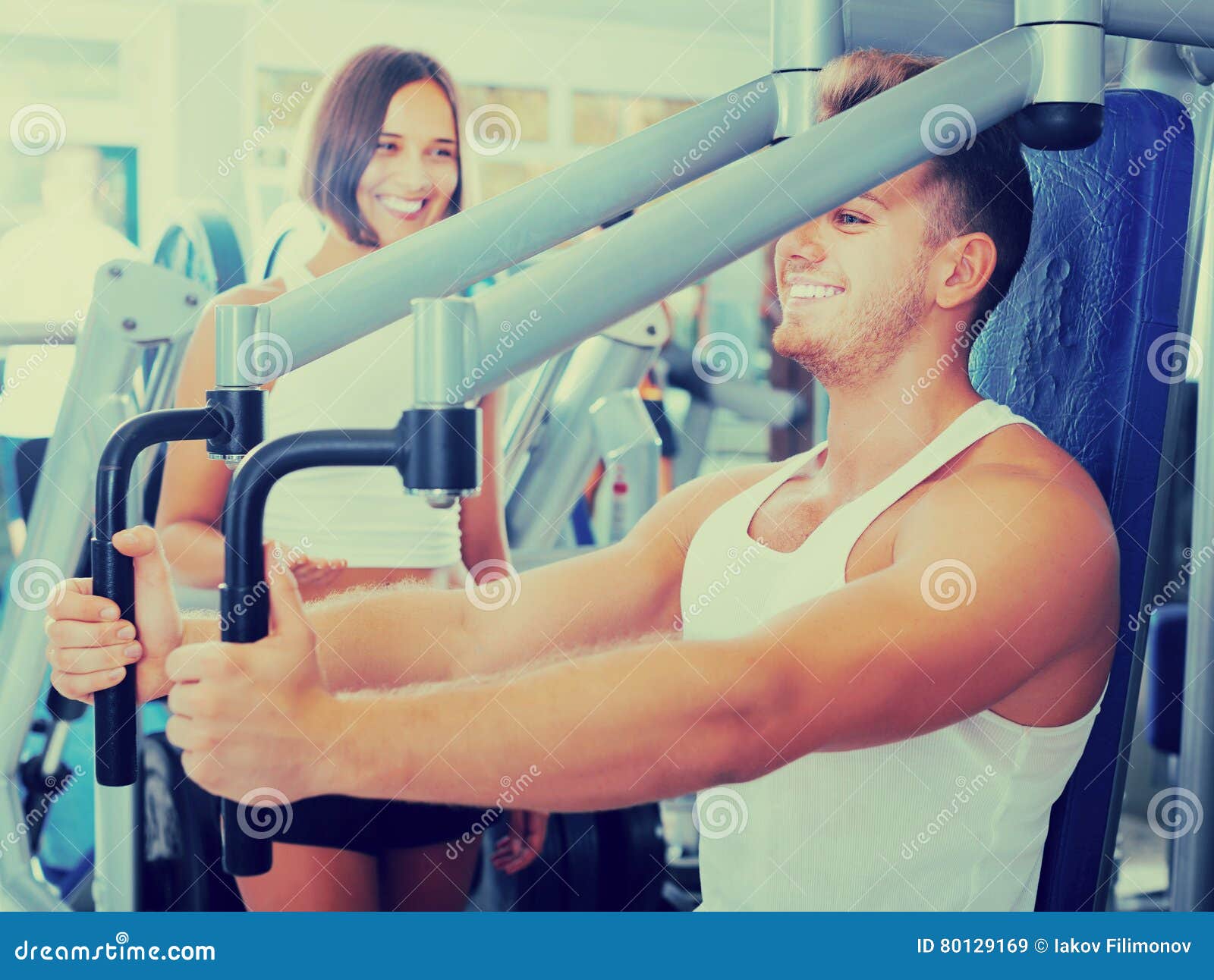 Female Assisting Man Using Fly Machine Stock Image - Image of male ...