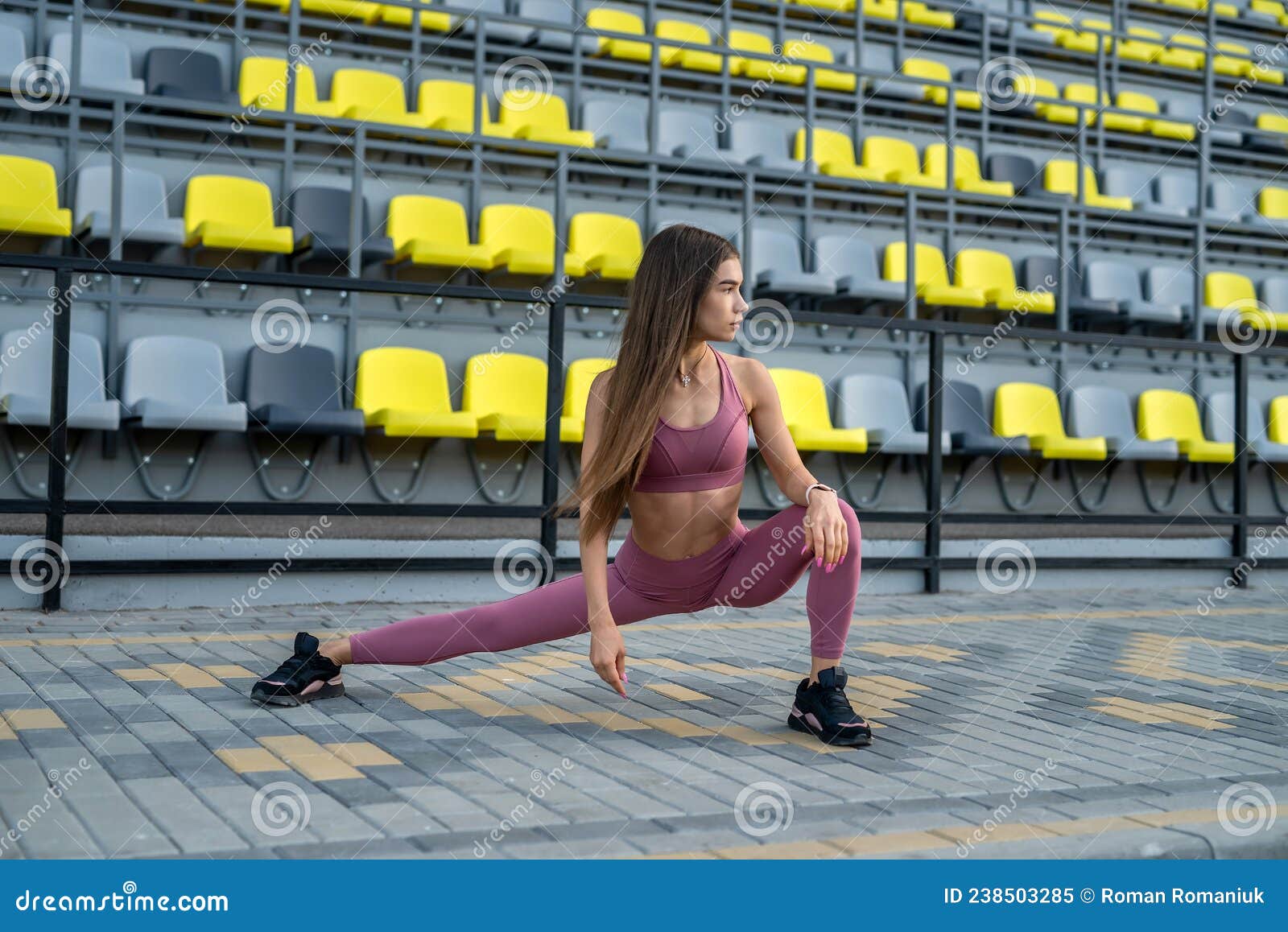 Female Athlet Doing Stretching Exercises Morning At Stadium Stock Image