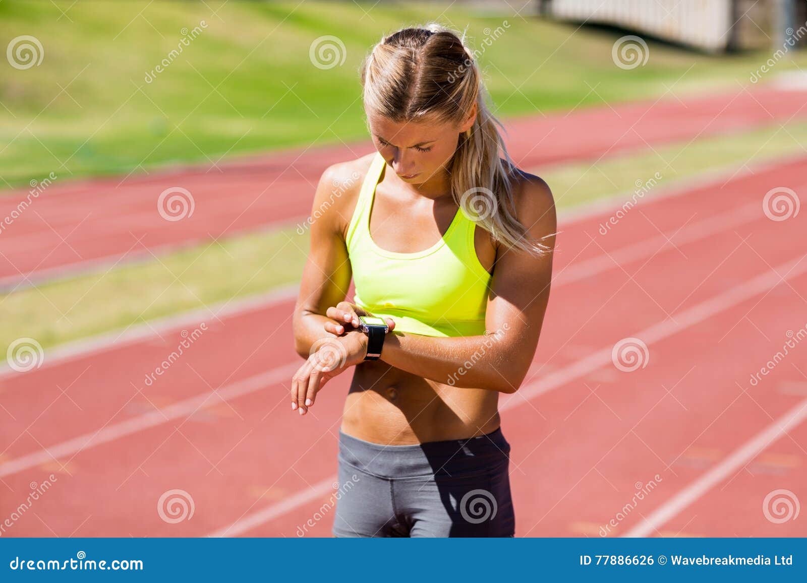 Female Athlete Checking Her Smart Watch Stock Photo - Image of ...