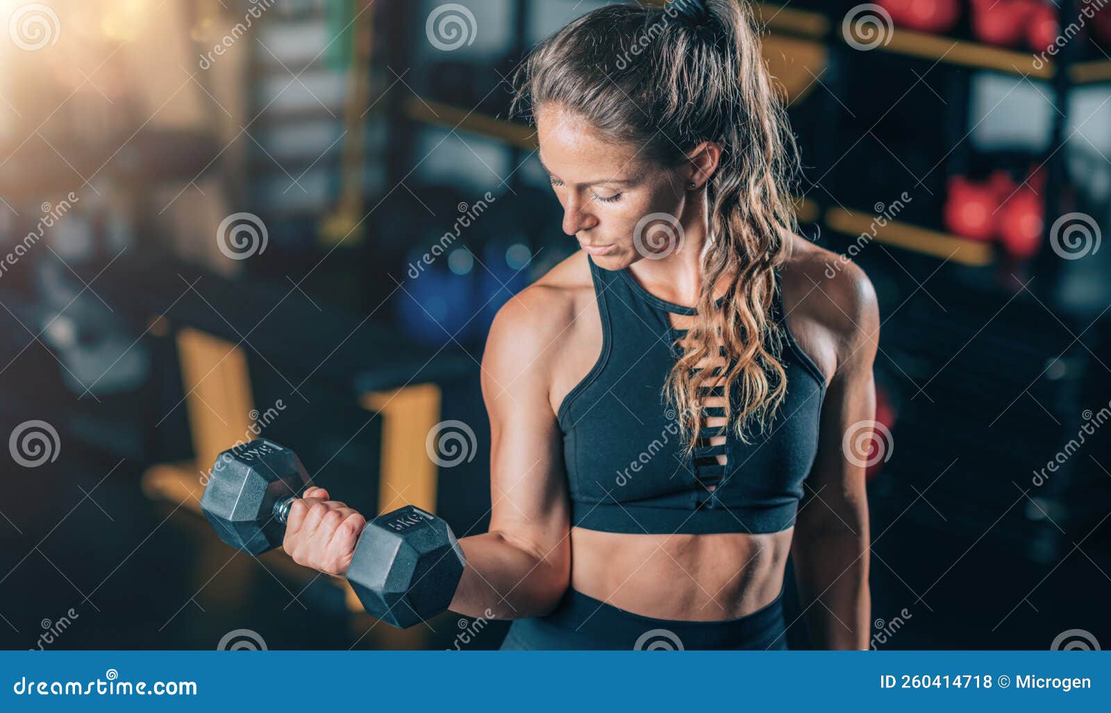Female Athlete Doing Biceps Exercise with Dumbbells. Strength Training ...