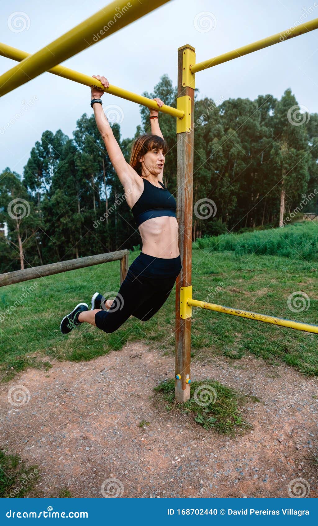 Female Athlete Doing Pull Up Exercises Stock Photo - Image of caucasian ...