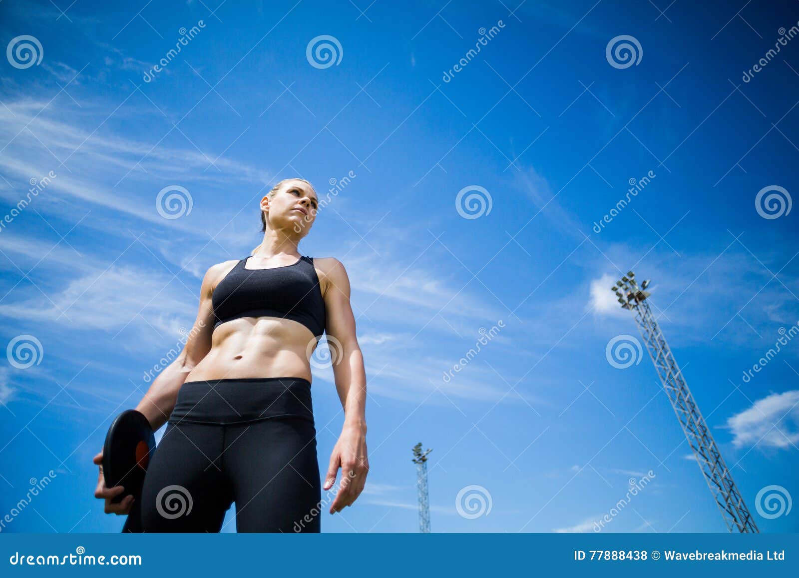 Female Athlete Holding a Discus Stock Photo - Image of athlete, aiming ...