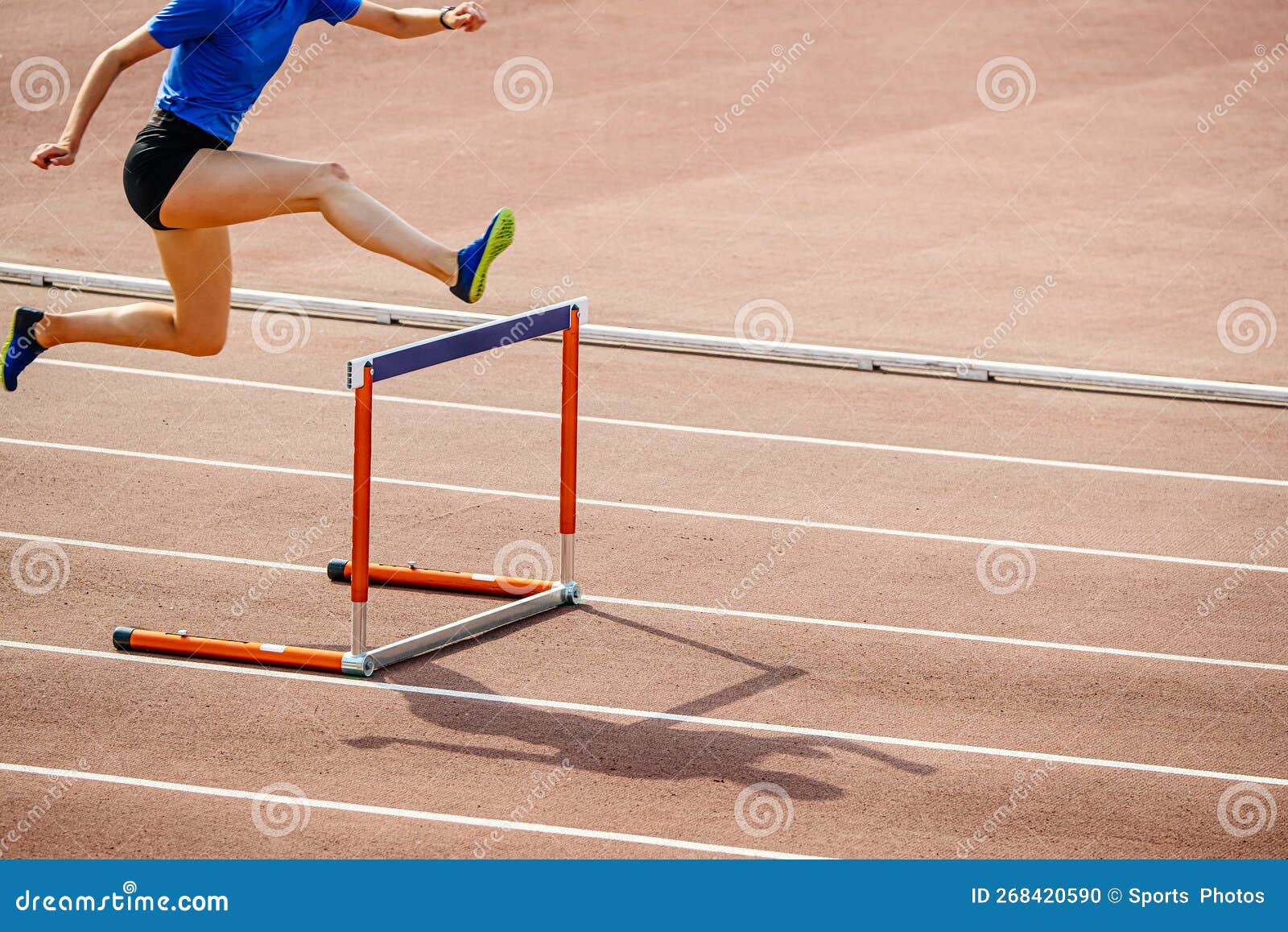 Female athlete hurdling stock photo. Image of hurdle - 268420590