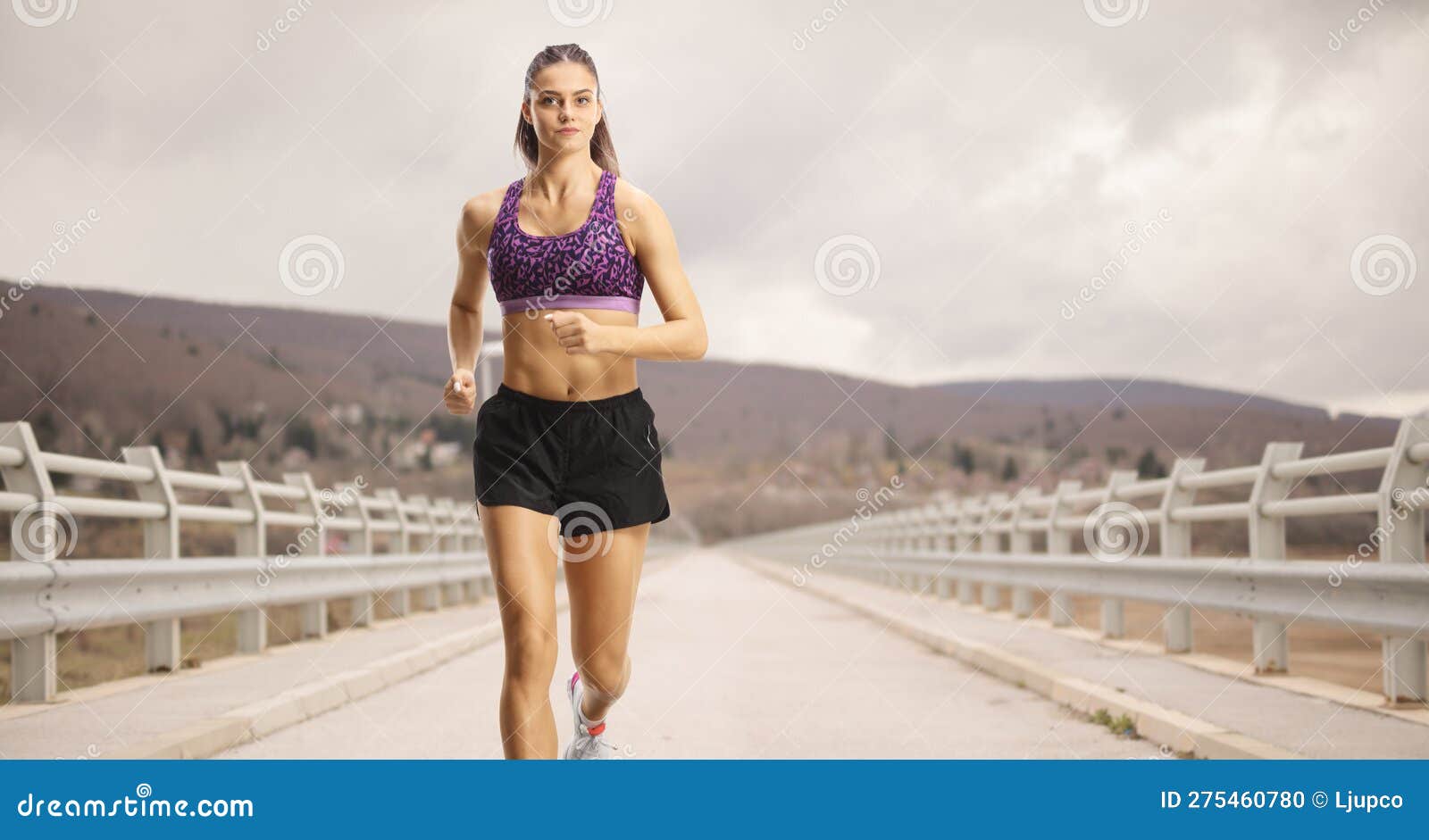 Female Athlete Running Over a Bridge Stock Photo - Image of running ...