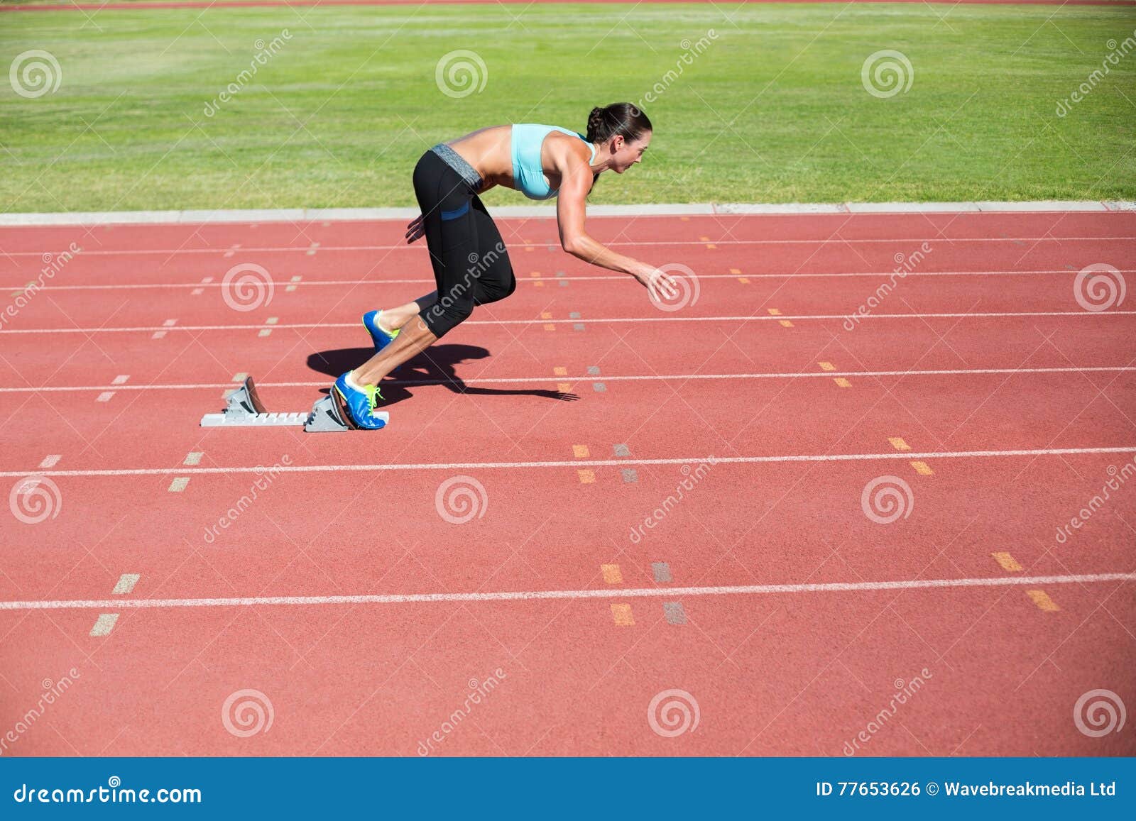 Female Athlete Running from Starting Blocks Stock Photo - Image of ...
