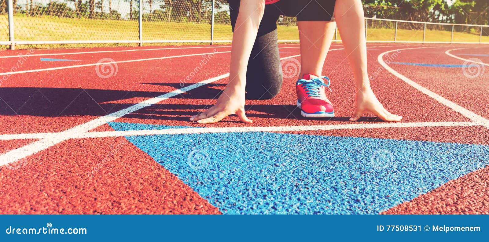 Female Athlete on the Starting Line of a Stadium Track Stock Image ...
