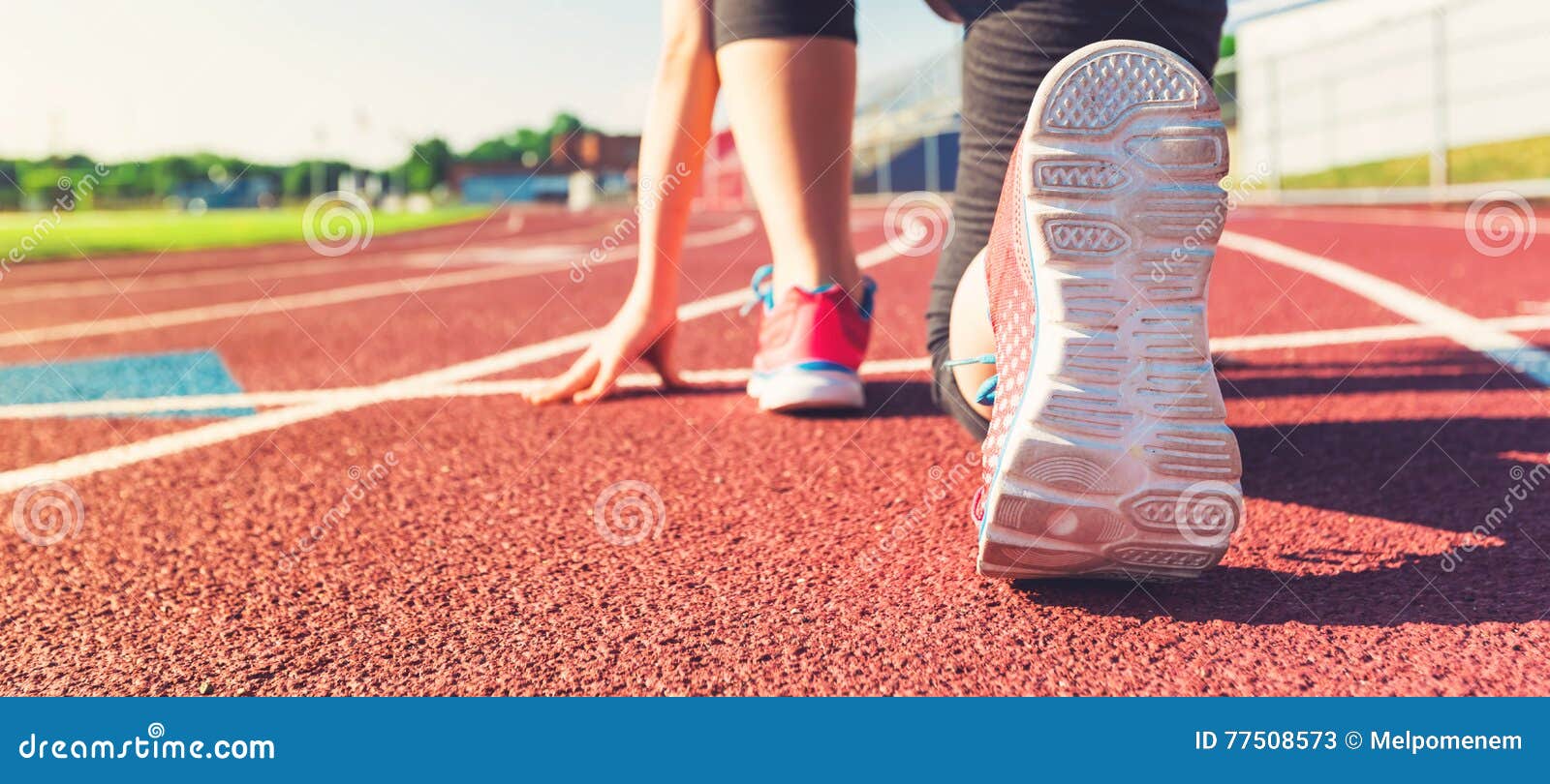 Female Athlete on the Starting Line of a Stadium Track Stock Image ...