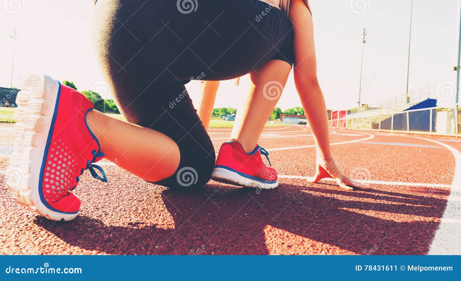 Female Athlete on the Starting Line of a Stadium Track Stock Image ...