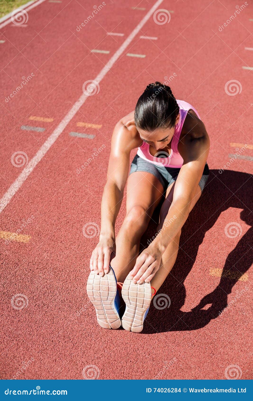 Female Athlete Stretching Her Hamstring Stock Photo - Image of fitness ...