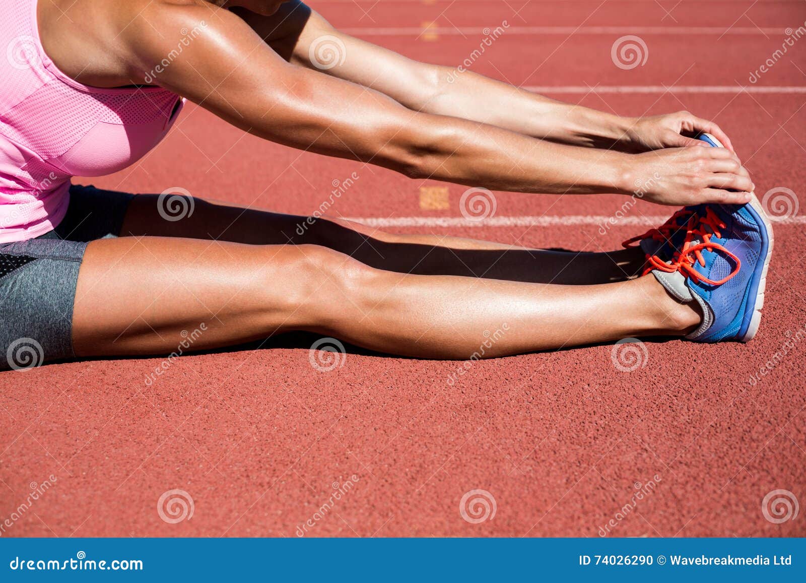 Female Athlete Stretching Her Hamstring Stock Photo - Image of stadium ...