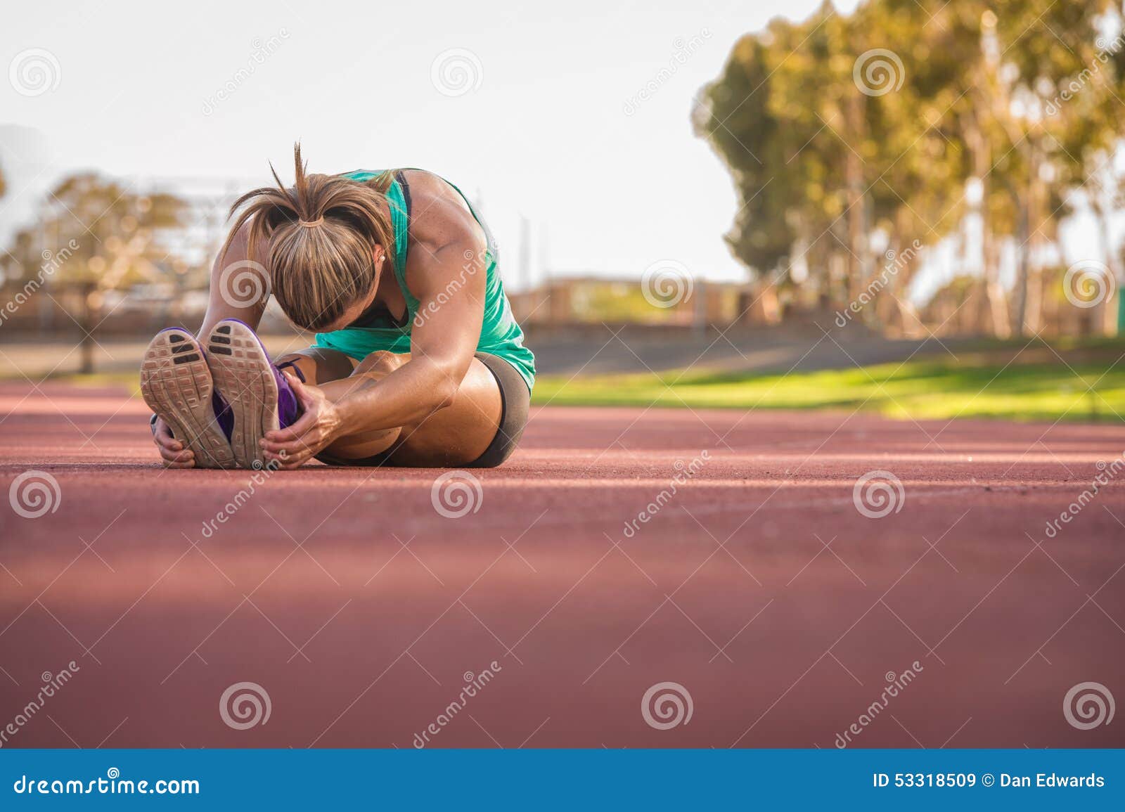 Female Athlete Stretching on a Running Track Stock Image - Image of ...