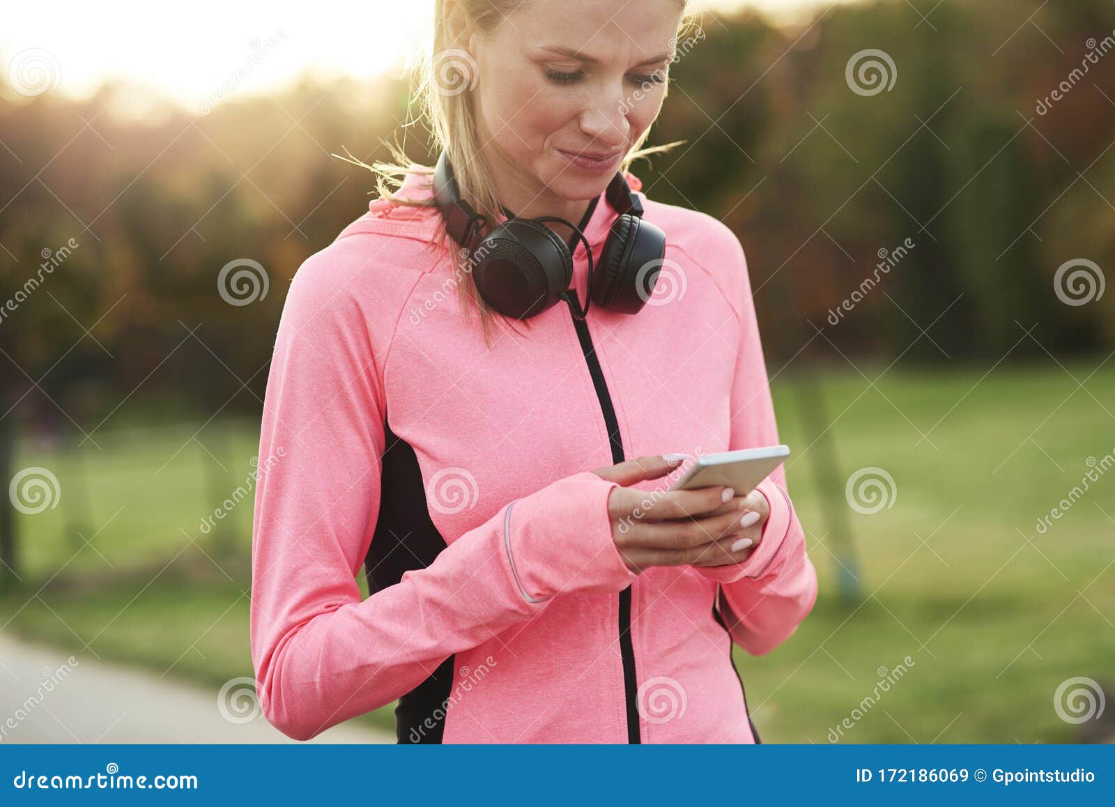 Athlete Using Mobile Phone during Jogging Training Stock Image - Image ...