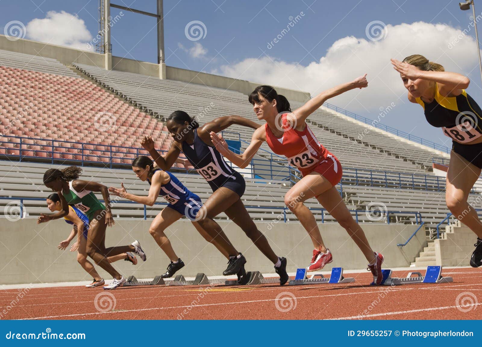 Female Athletes Taking Off From Starting Blocks Royalty-Free Stock ...