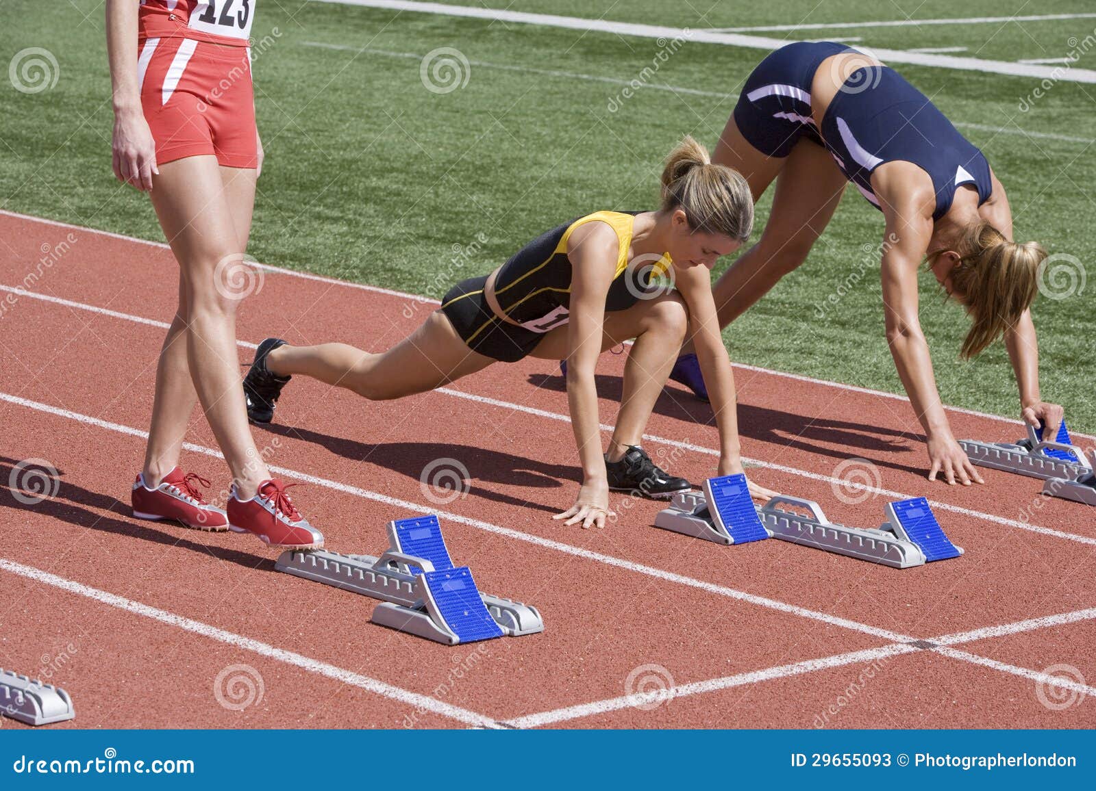 Female Athletes Warming Up At Starting Line Royalty-Free Stock Photo ...
