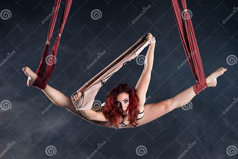 Female Athletic And Flexible Aerial Circus Artist With Redhead Dancing