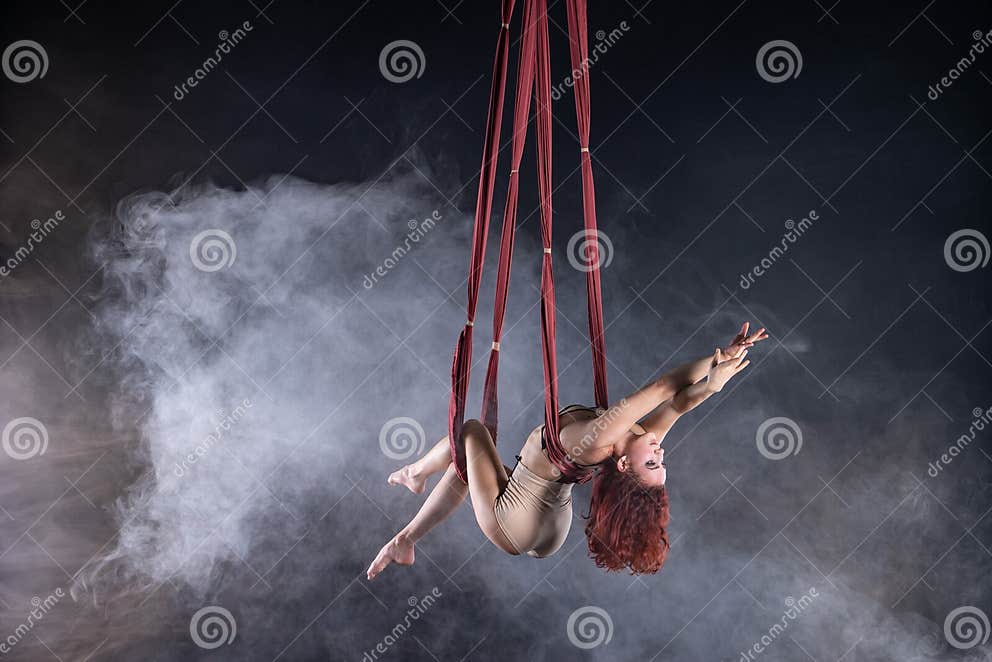 Female Athletic And Flexible Aerial Circus Artist With Redhead Dancing