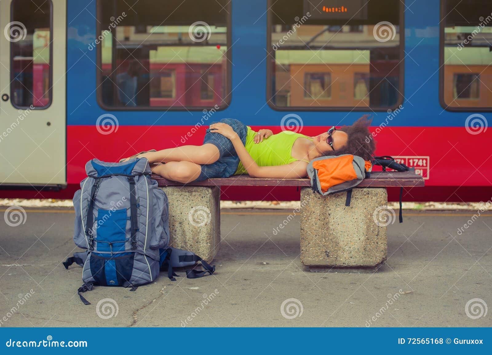 Female Backpacker Tourist Napping on a Bench Stock Photo - Image of ...