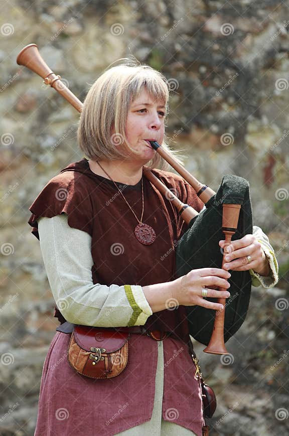 Female bagpiper editorial stock photo. Image of craft - 18958823
