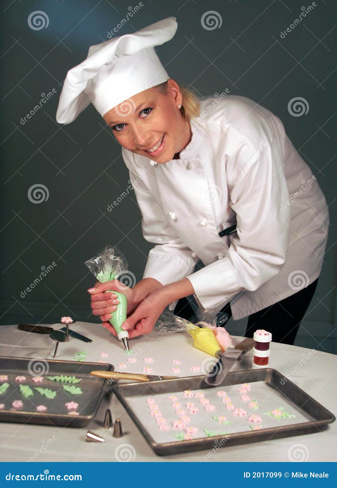 Female Baker In Bakery Selling Bread By Basket Stock Photography ...