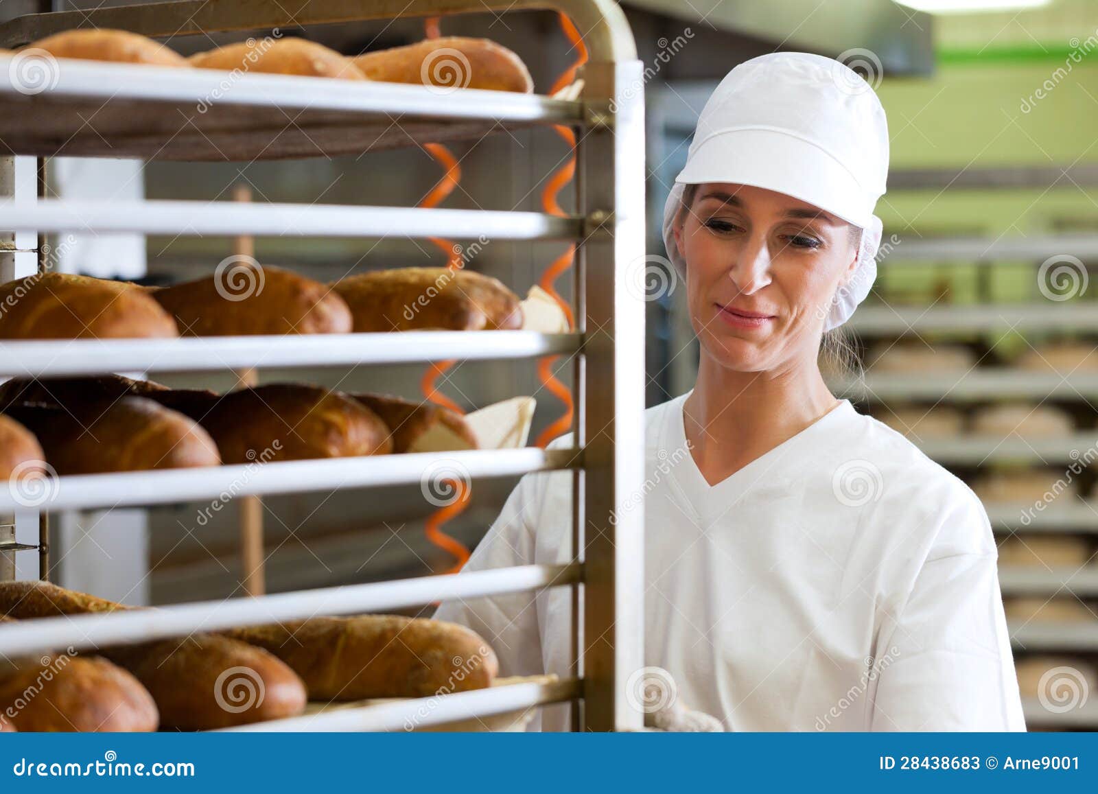 Female baker baking bread stock image. Image of manufacturing - 28438683