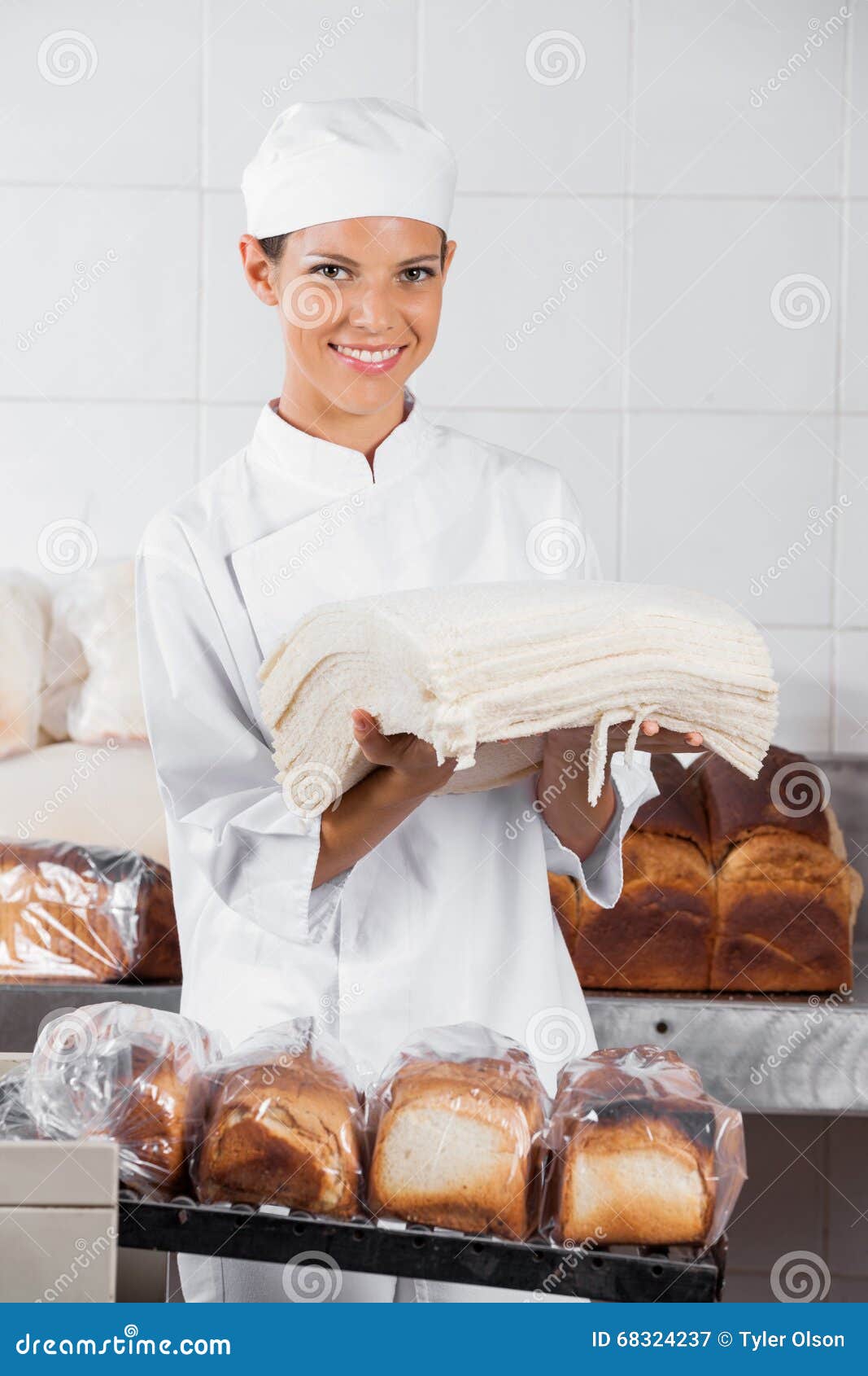 Female Baker Holding Bread Slices in Bakery Stock Image - Image of ...