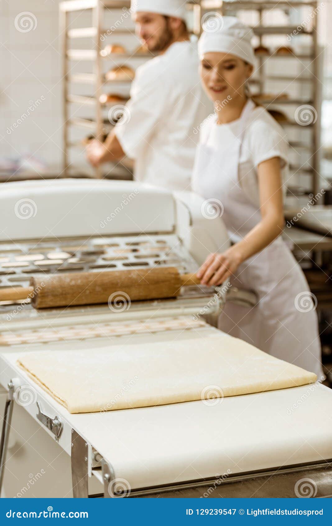 Female Baker Using Industrial Dough Roller Stock Image - Image of ...