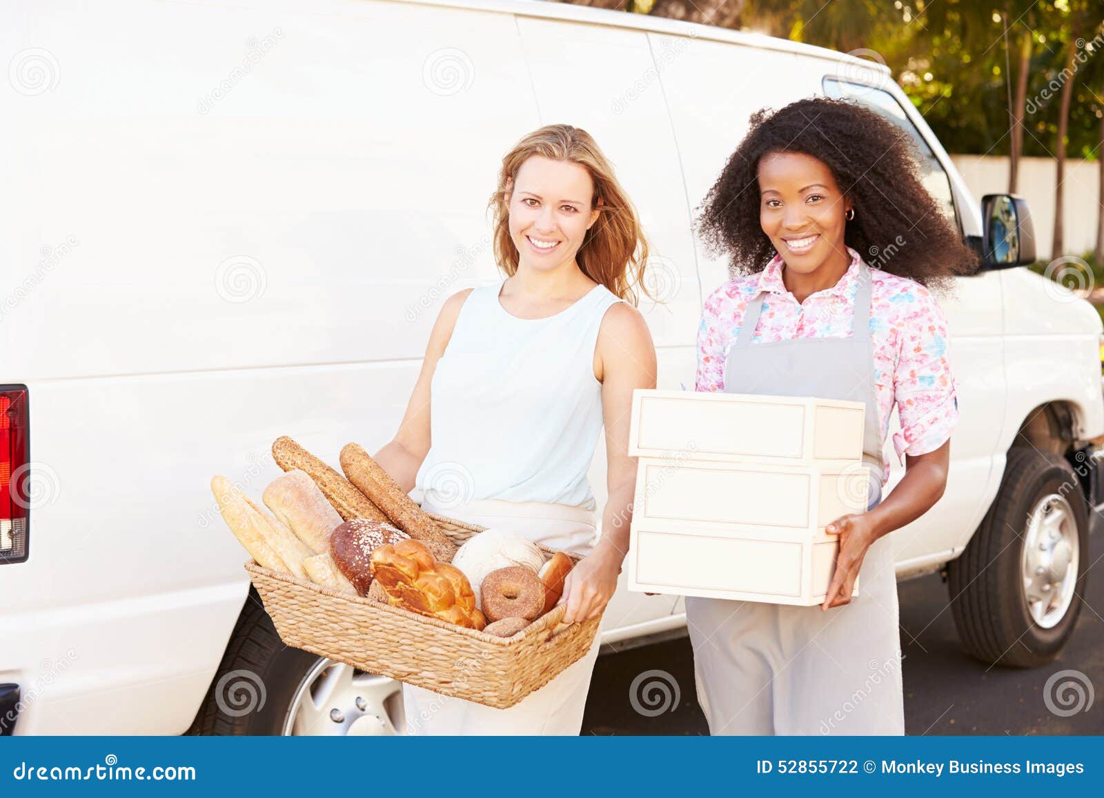 Female Bakers Unloading Bread and Cakes from Van Stock Photo - Image of ...