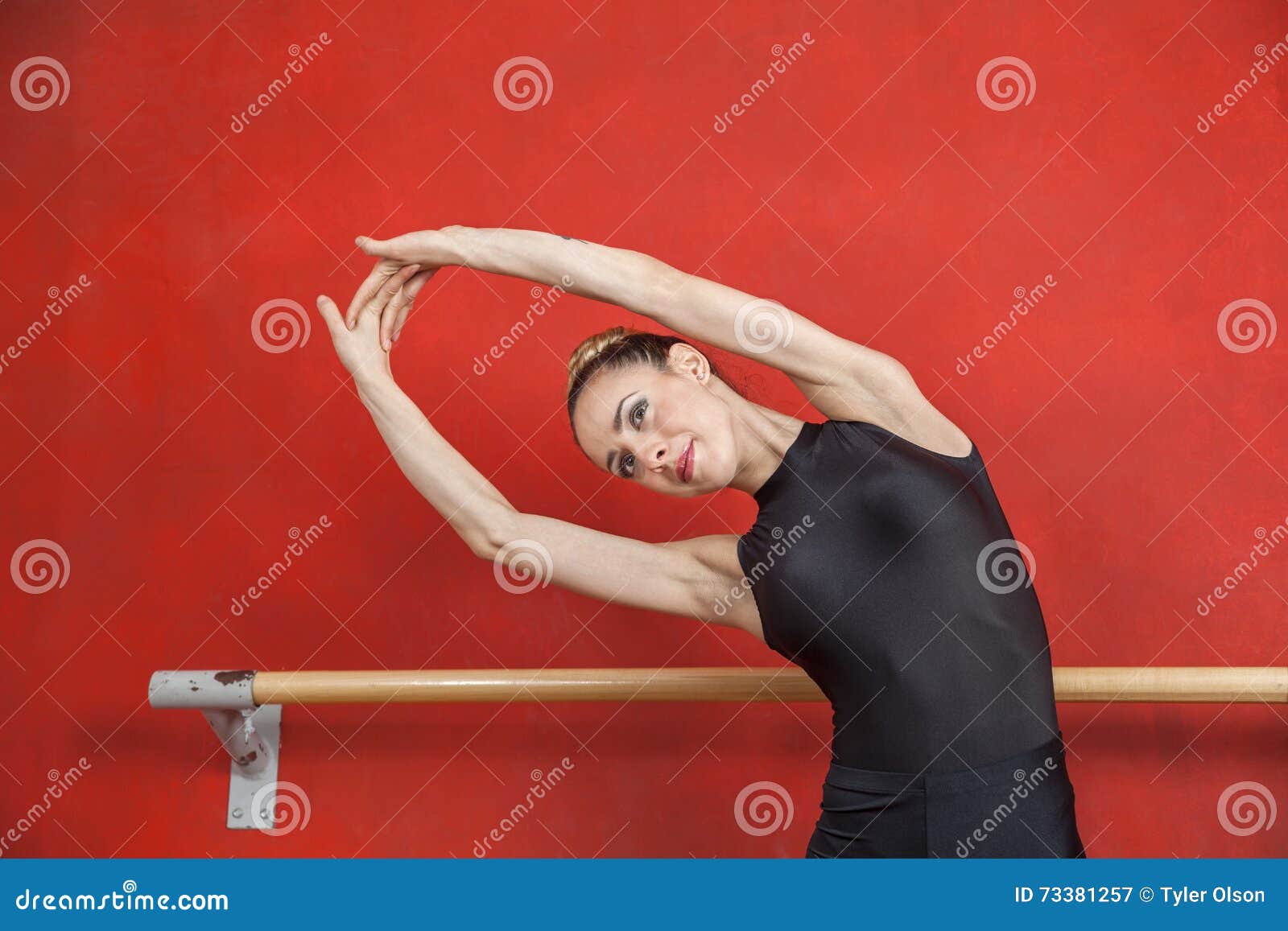 Female Ballet Dancer Stretching with Hands Raised Stock Image - Image ...