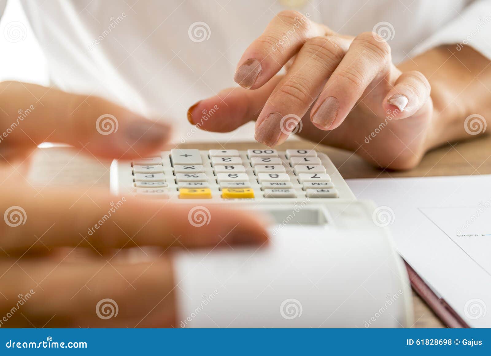 Female Banker Calculating Expenses and Income Using Adding Machine ...