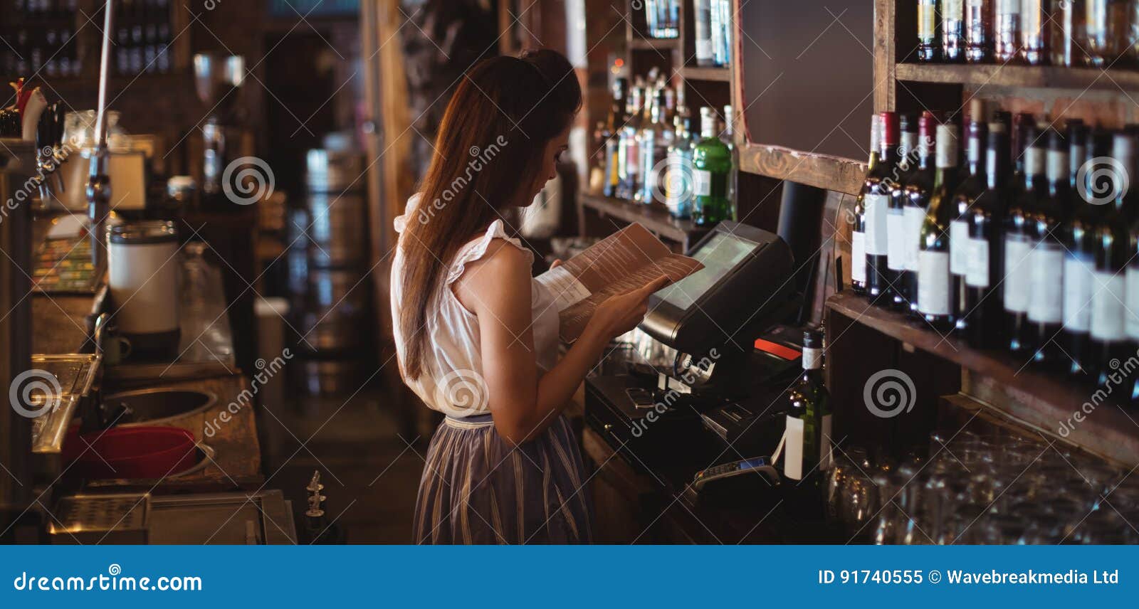 Female Bar Tender Looking Menu Pub Stock Photos - Free & Royalty-Free ...