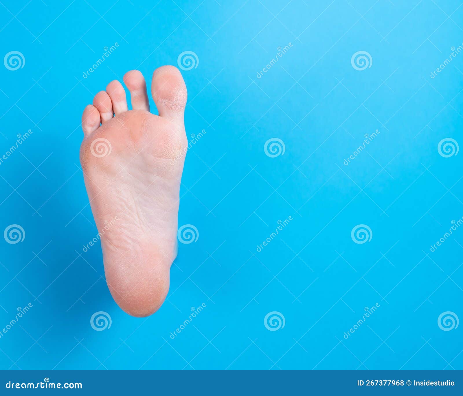 Female Bare Foot on a Blue Background. Stock Photo - Image of treatment ...